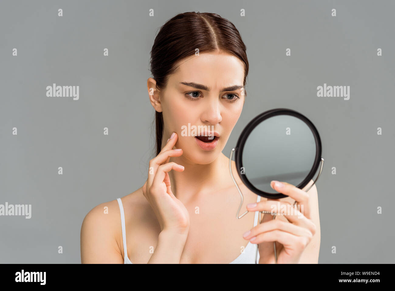 Woman face mirror shocked hi-res stock photography and images - Alamy