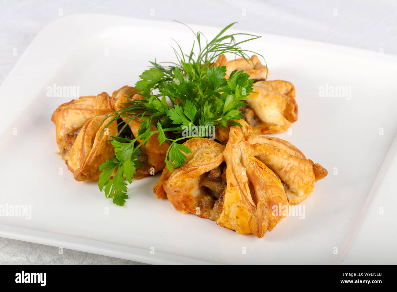Pastry with meat served parsley Stock Photo - Alamy