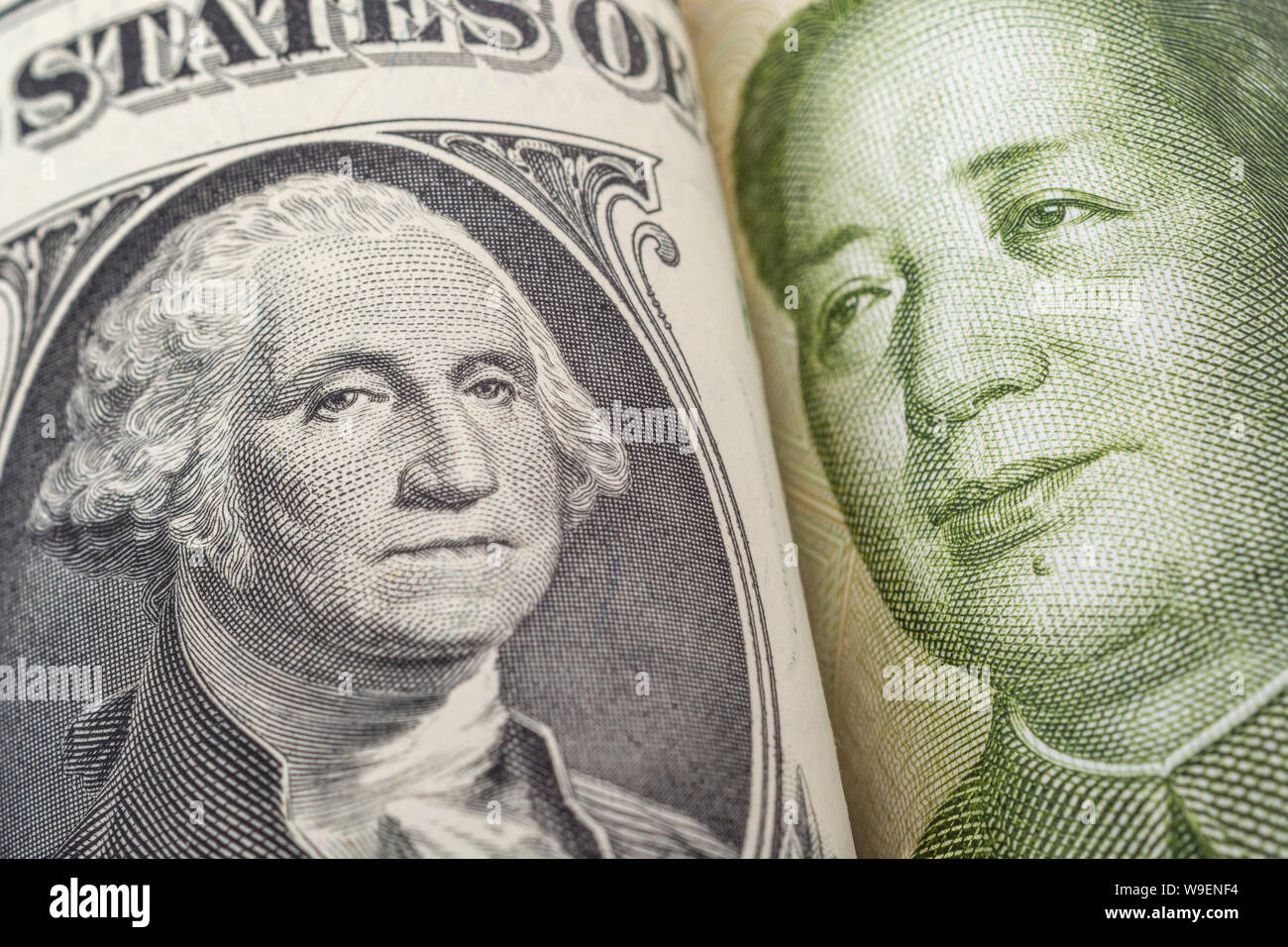 Macro close-up shot U.S. 1 Dollar bill banknote with Chinese Yuan 1 ...