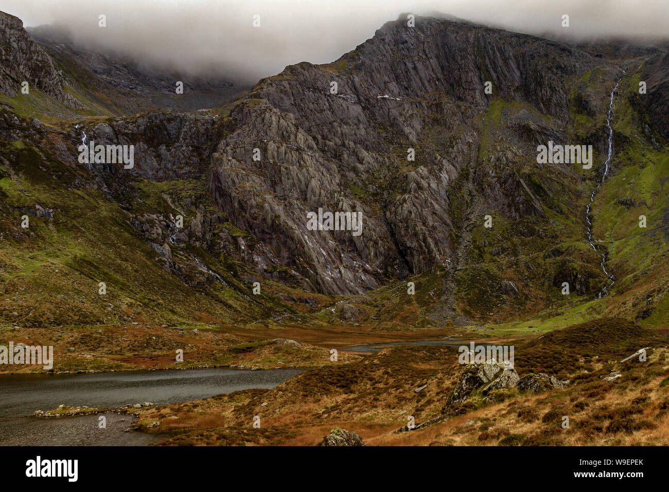 A view of Cwm Idwal lake and the Devils Kitchen and the Glyder Fawr ...