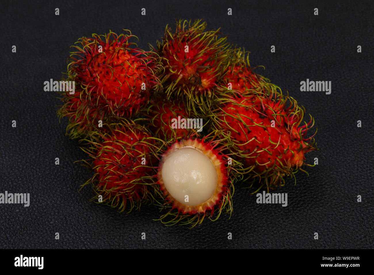 Tropical sweet exotic fruit Rambutan heap Stock Photo - Alamy