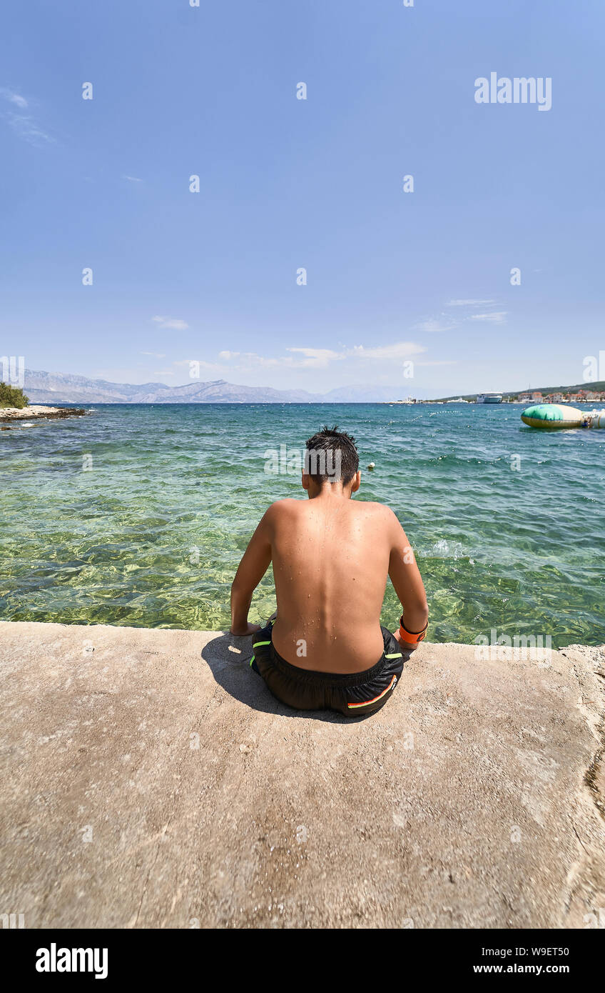 Little boy sited seeing the sea Stock Photo - Alamy