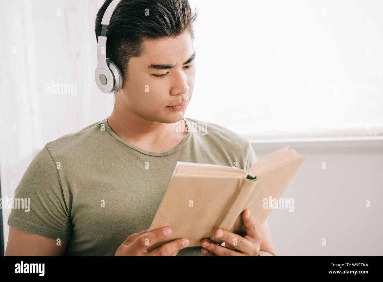 Asian man reading book hi-res stock photography and images - Alamy