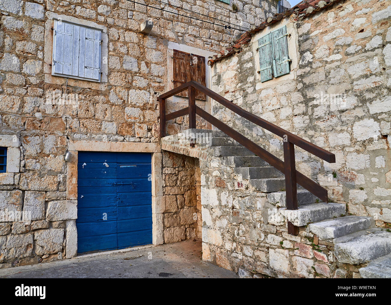 Wooden windows in a stone building Stock Photo - Alamy