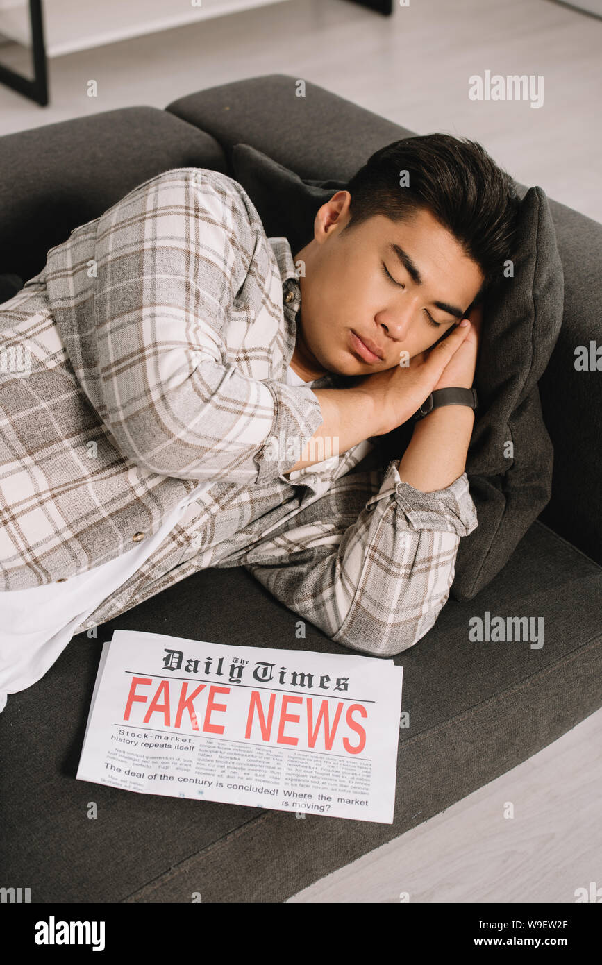 Young man sleeping newspaper hi-res stock photography and images - Alamy