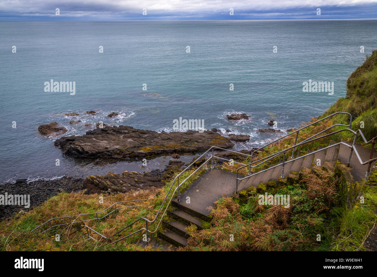 spectacular cliff walk at the Blackhead Lighthouse, Co Antrim, Northern ...
