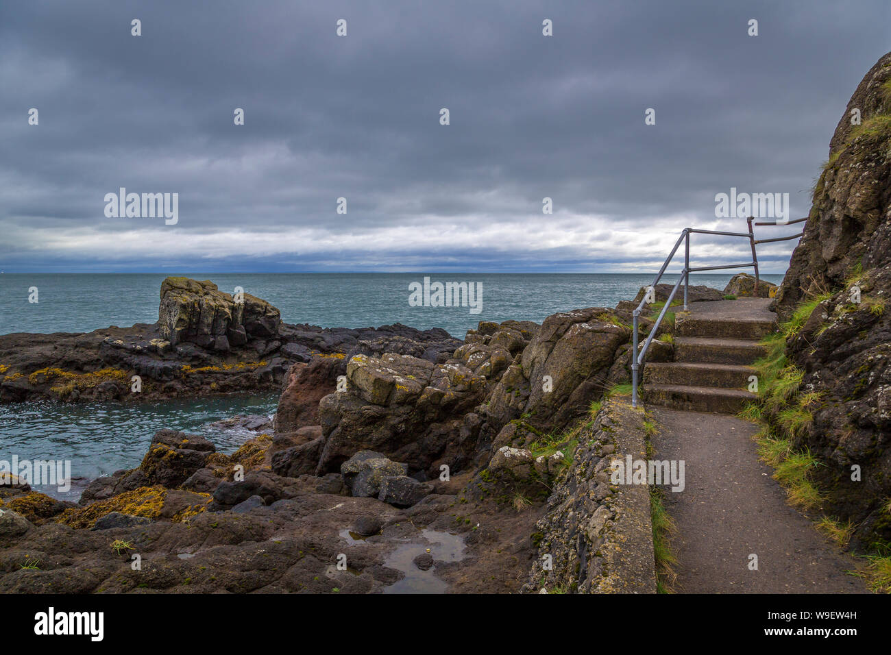 spectacular cliff walk at the Blackhead Lighthouse, Co Antrim, Northern ...