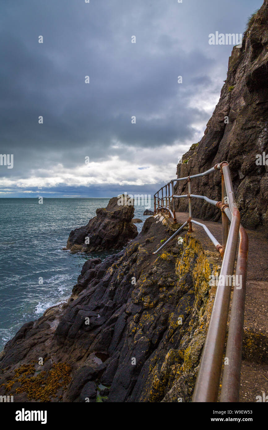 spectacular cliff walk at the Blackhead Lighthouse, Co Antrim, Northern ...