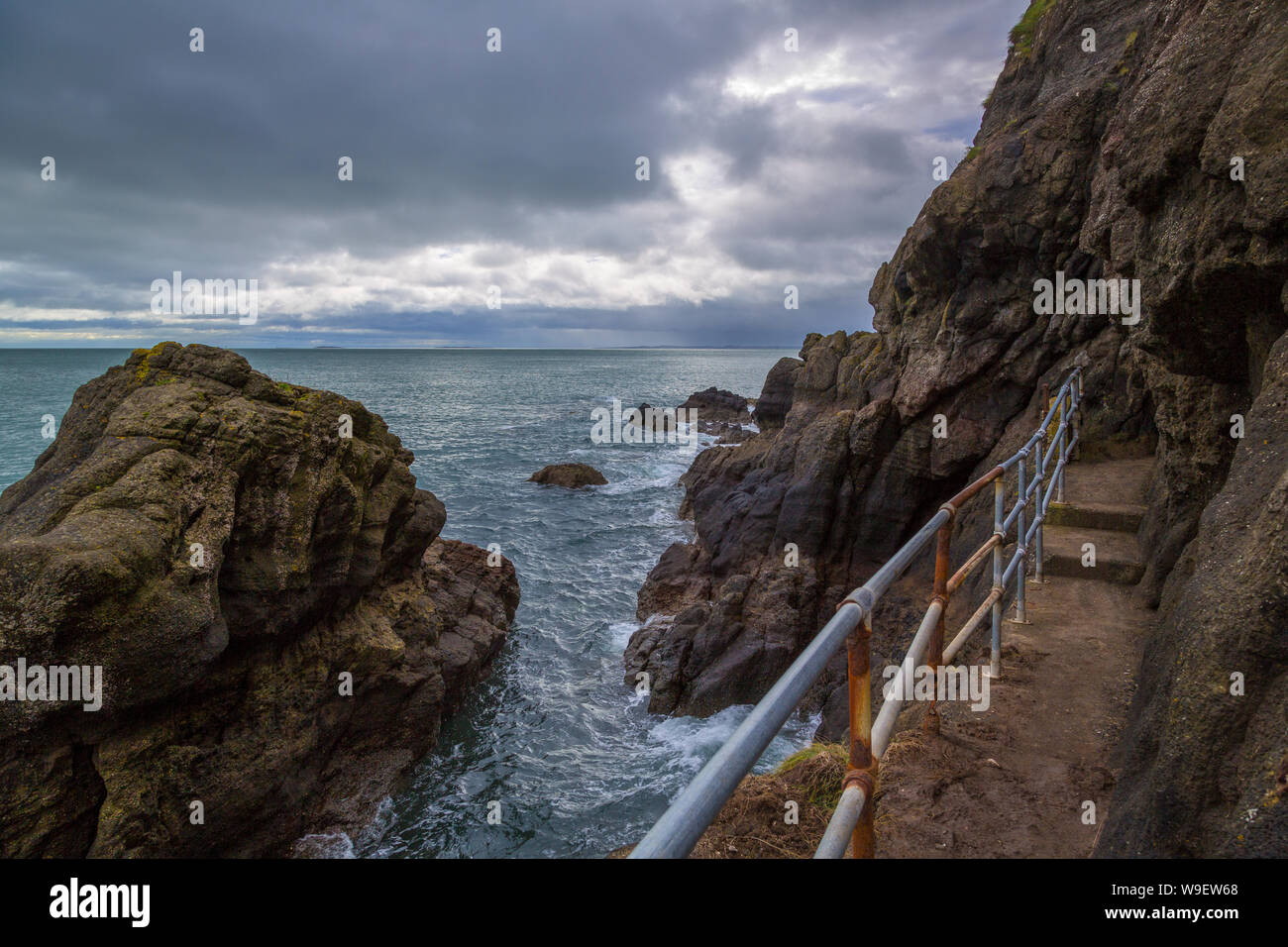 spectacular cliff walk at the Blackhead Lighthouse, Co Antrim, Northern ...