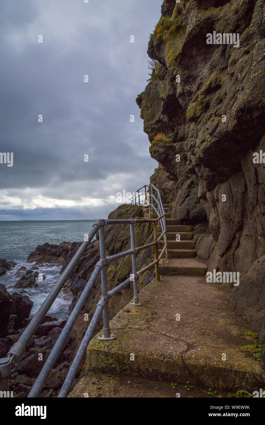 spectacular cliff walk at the Blackhead Lighthouse, Co Antrim, Northern ...