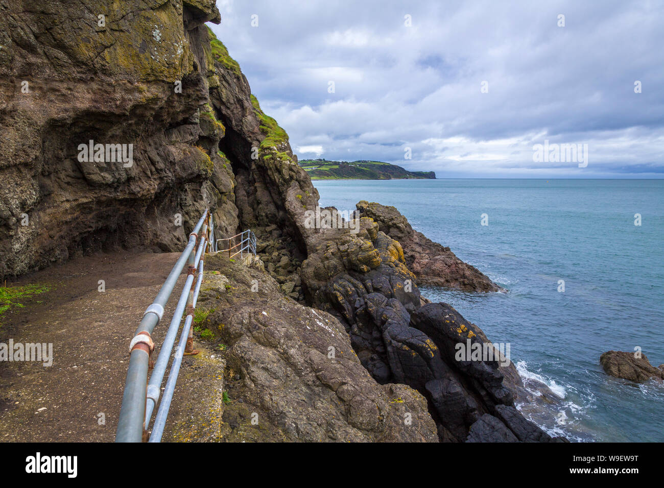 spectacular cliff walk at the Blackhead Lighthouse, Co Antrim, Northern ...