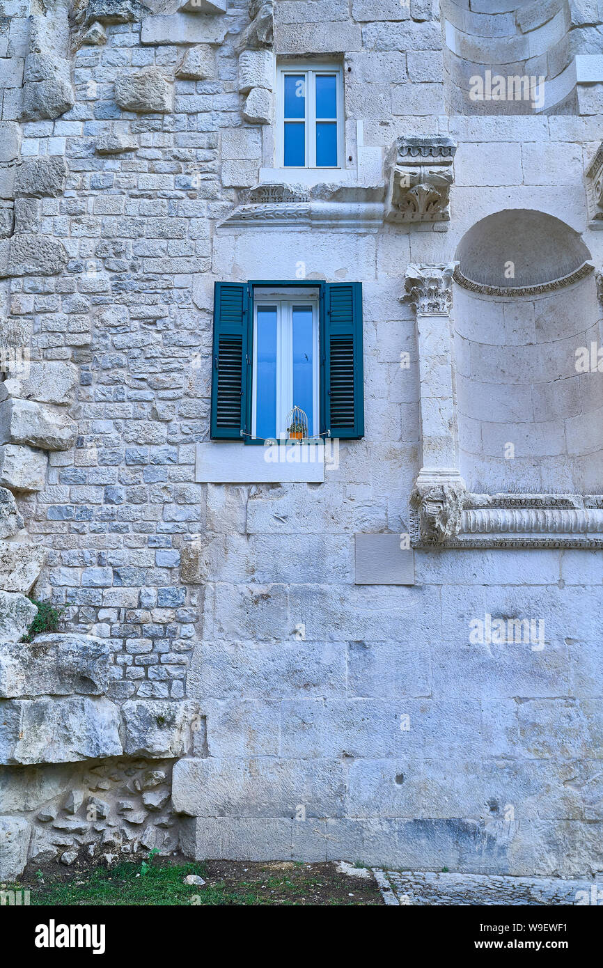 Blue window in a stone wall Stock Photo - Alamy