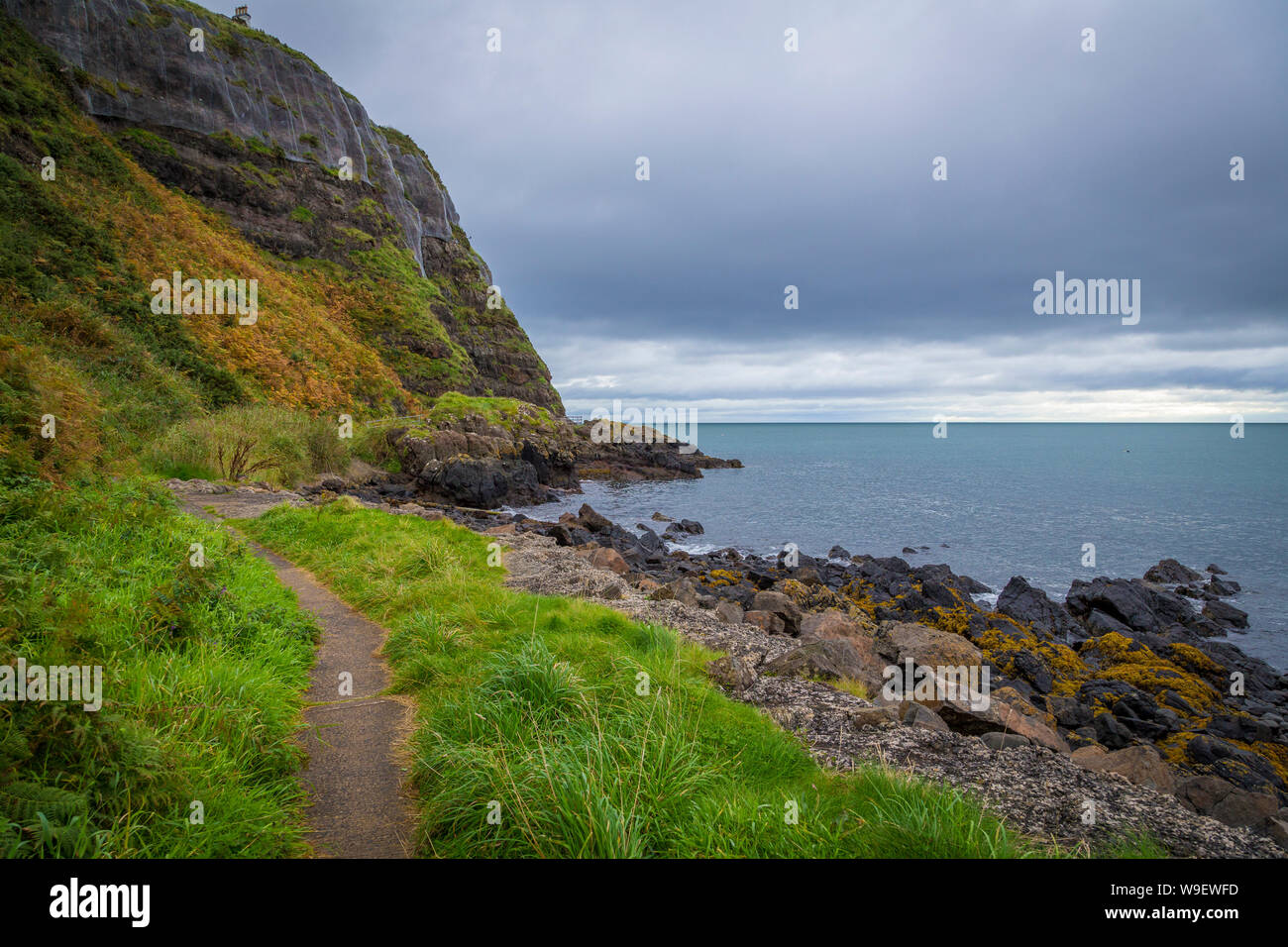 spectacular cliff walk at the Blackhead Lighthouse, Co Antrim, Northern ...