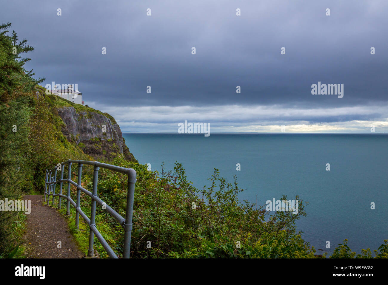 spectacular cliff walk at the Blackhead Lighthouse, Co Antrim, Northern ...