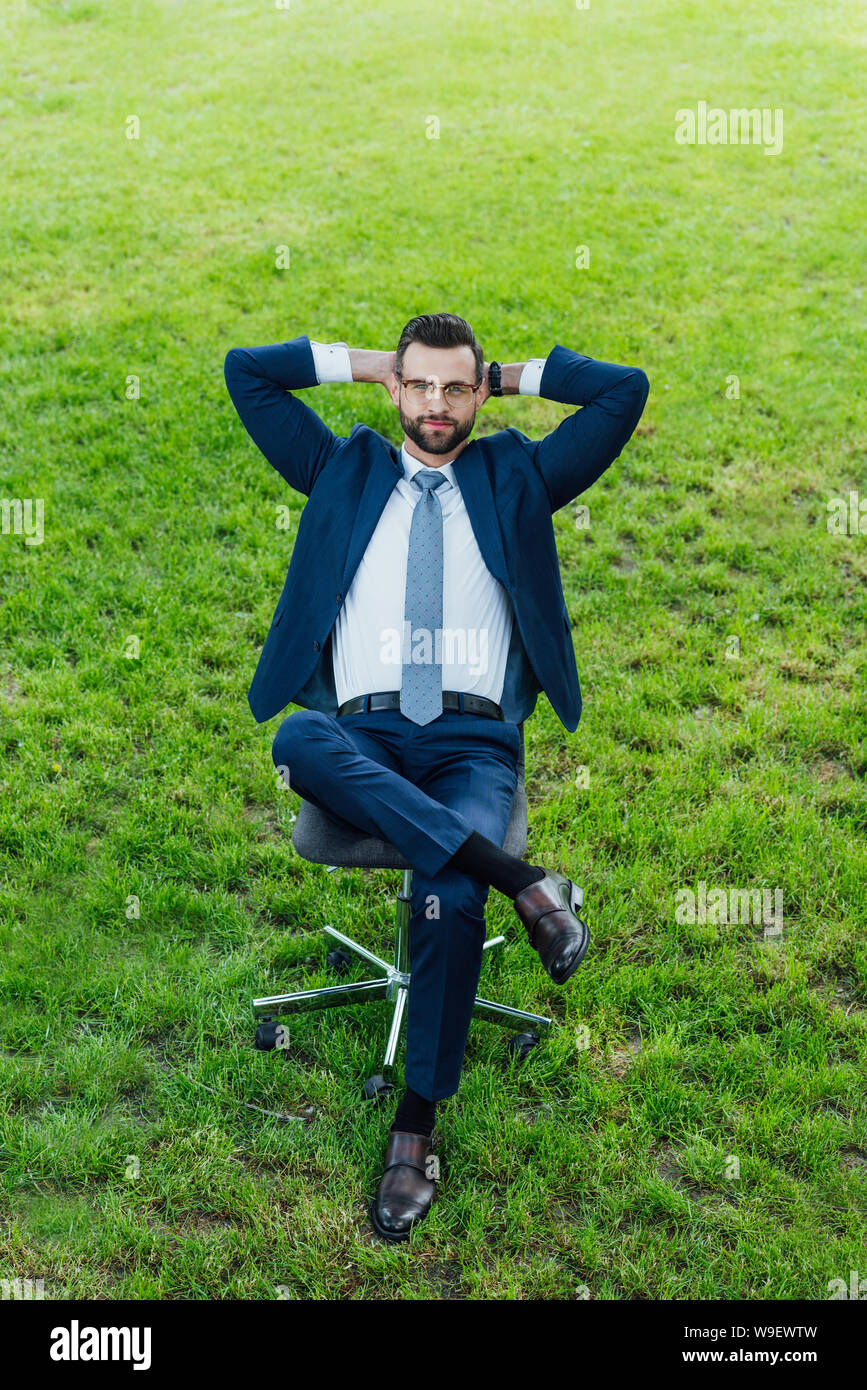 Arms behind head hi-res stock photography and images - Alamy