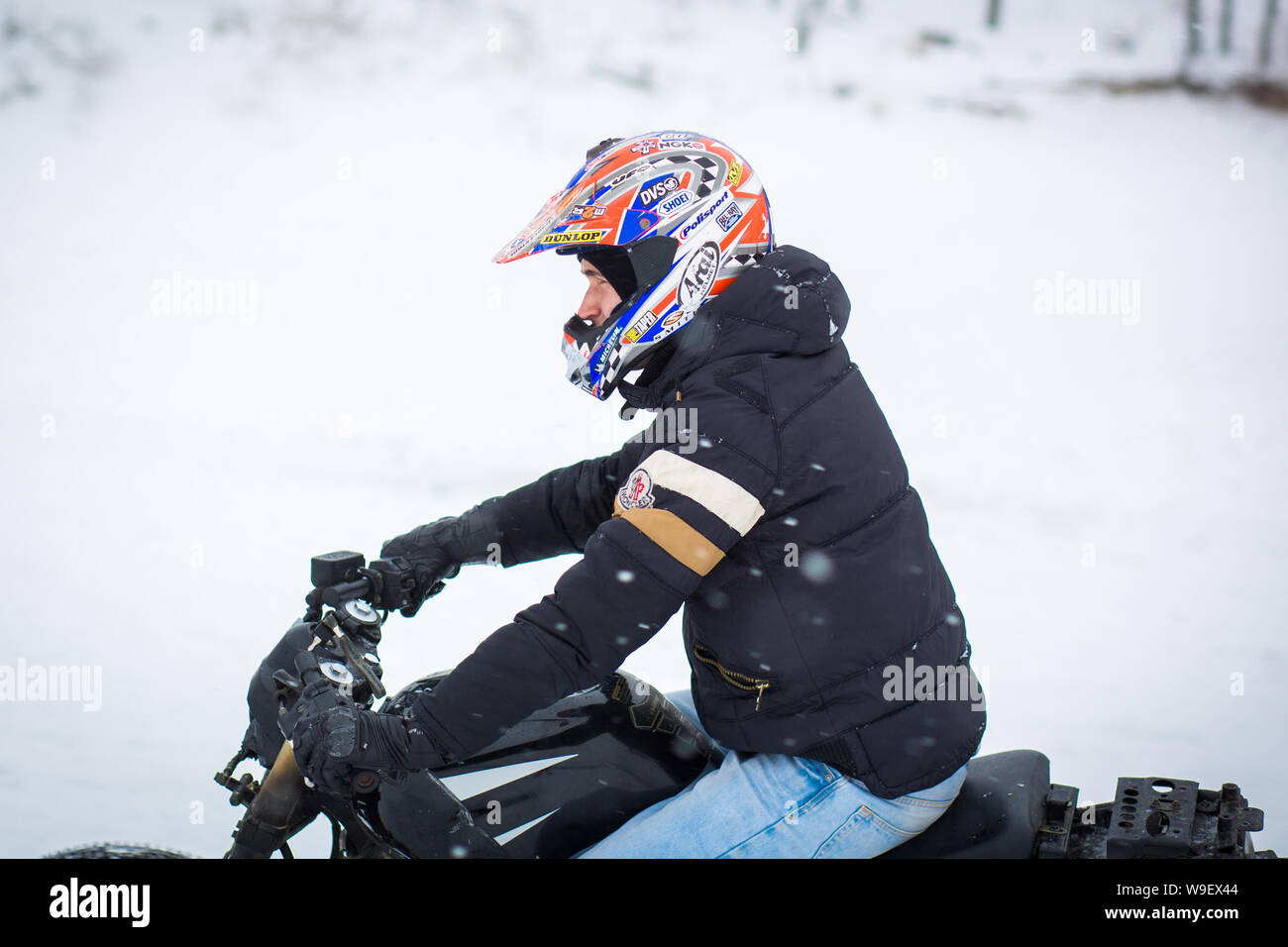A guy rides a motorcycle on a frozen lake Stock Photo - Alamy