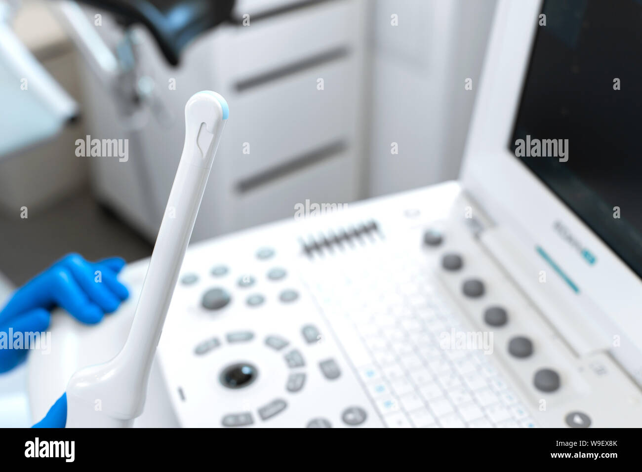 the gynecologist holds the sensor for vaginal examination with an ...