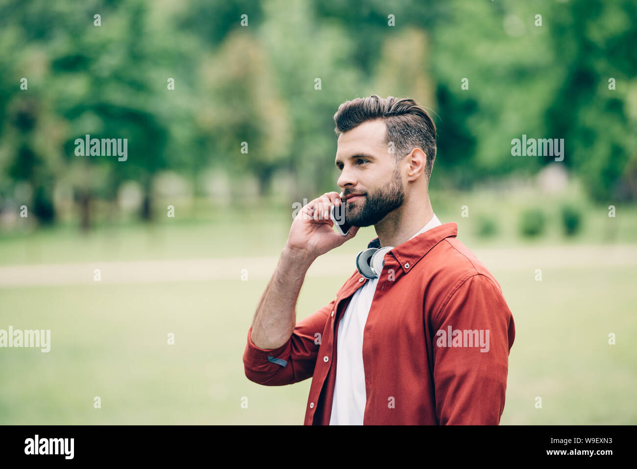 Man standing in park hi-res stock photography and images - Alamy