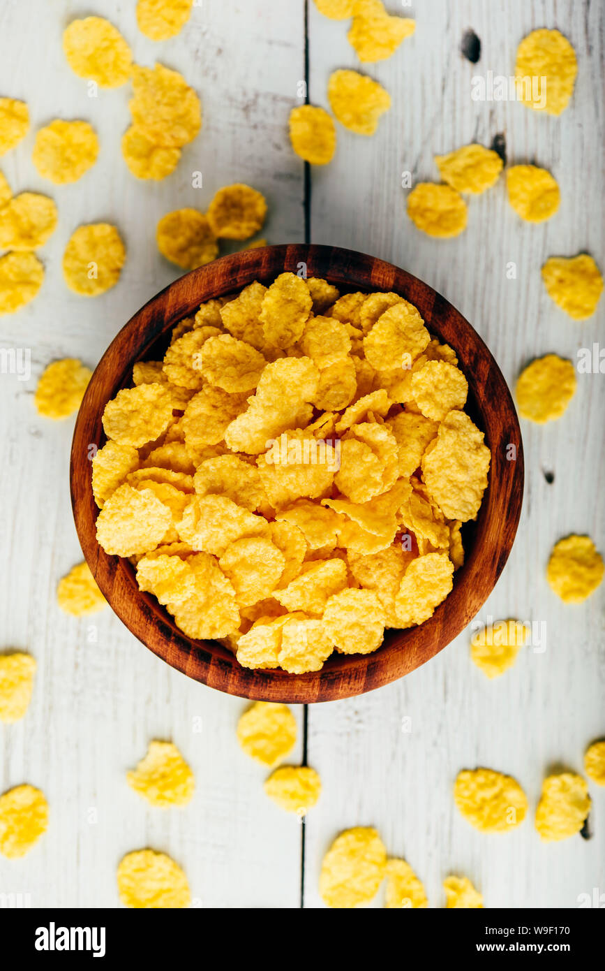 Breakfast cornflakes in a wooden rustic bowl. View from above Stock ...
