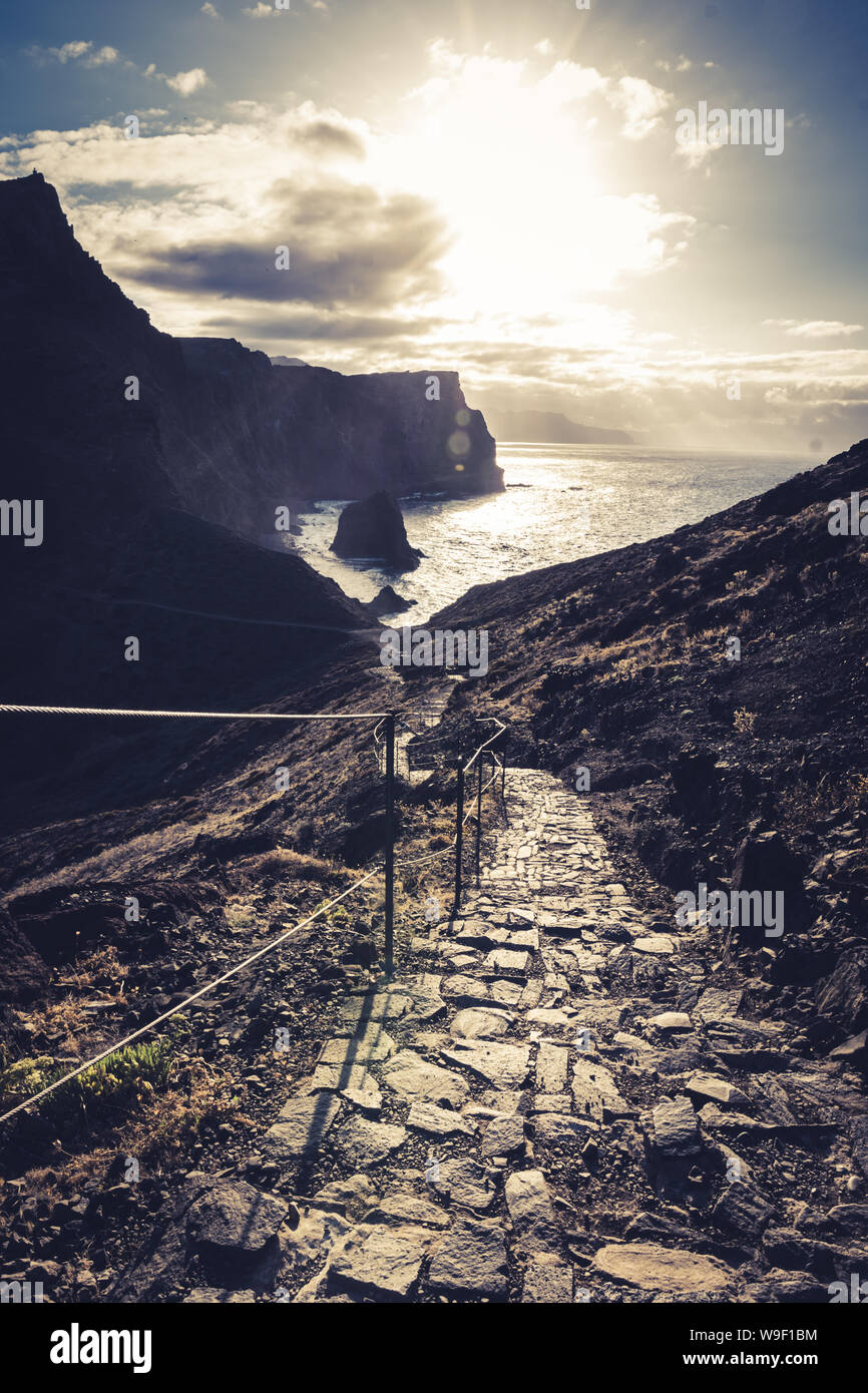 Stone steps in a rough rocky cliff landscape on a hiking trail going ...