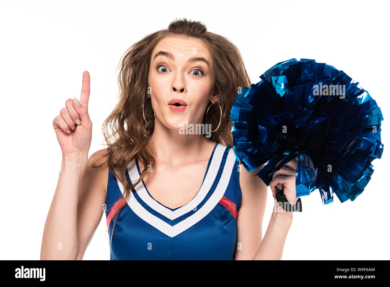 excited cheerleader girl in blue uniform holding pompom and showing ...