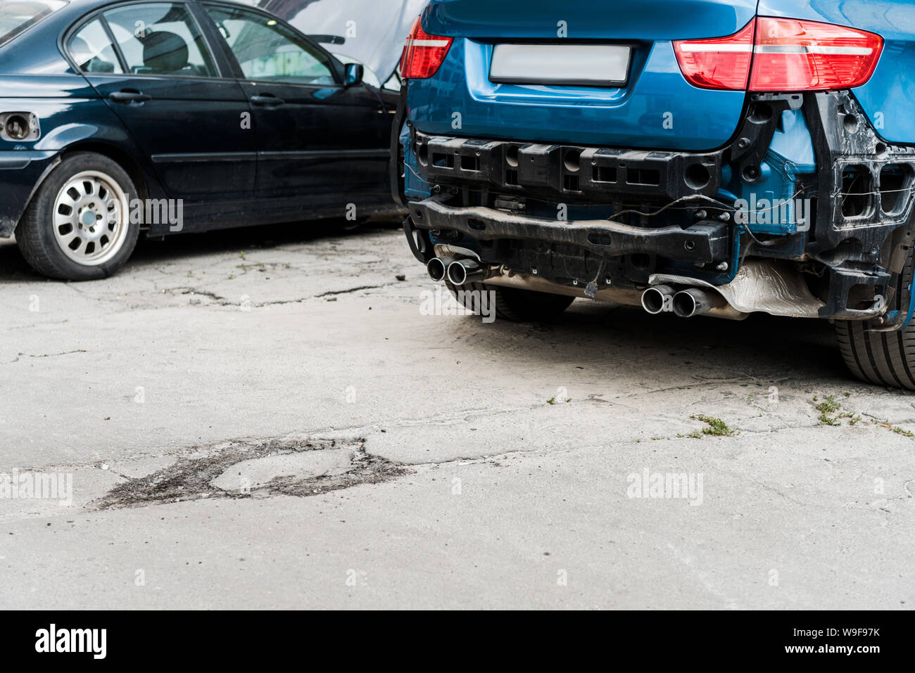 crashed blue car after car accident near modern automobile Stock Photo ...