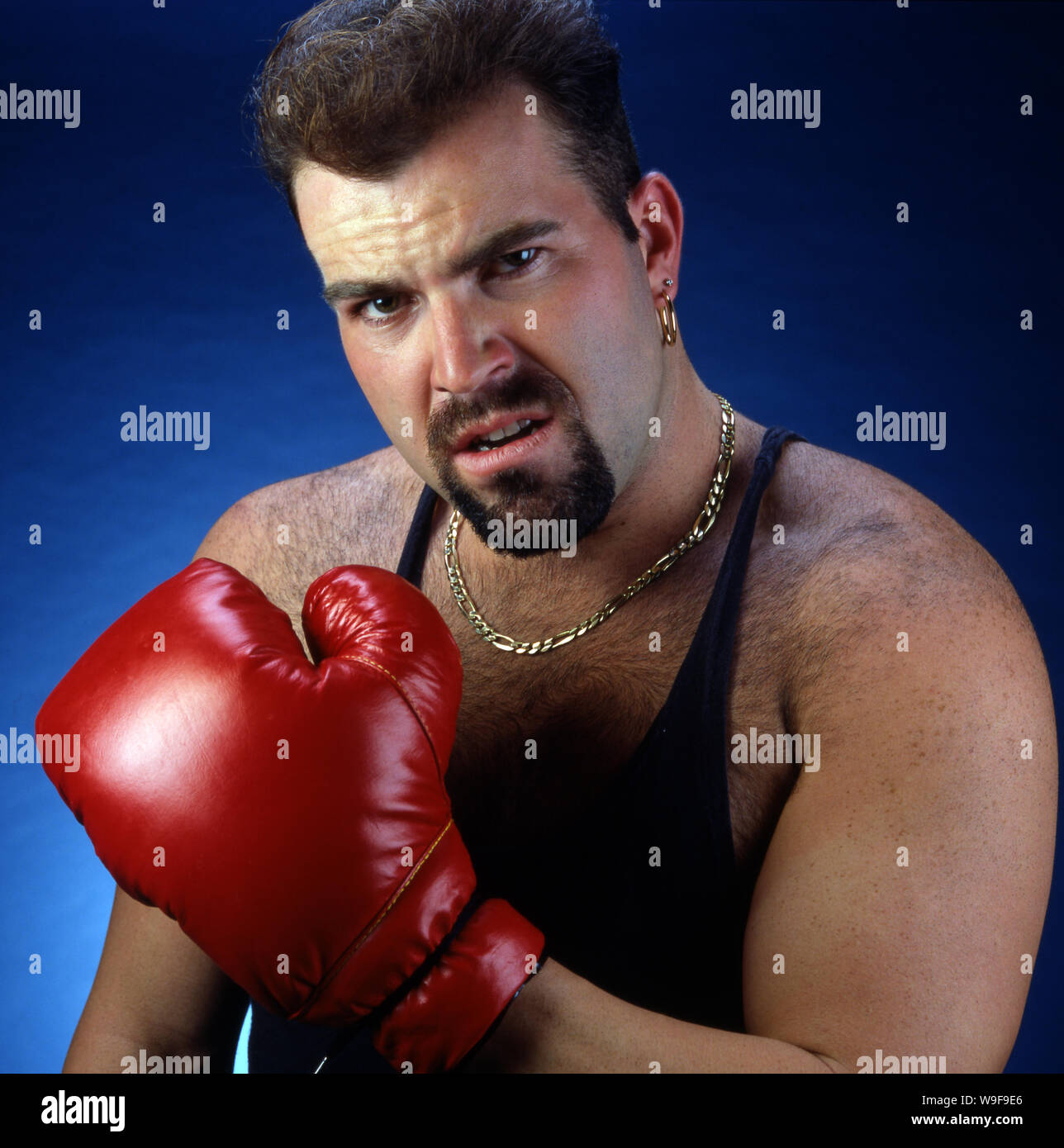 Bearded Man in red boxing gloves Stock Photo - Alamy