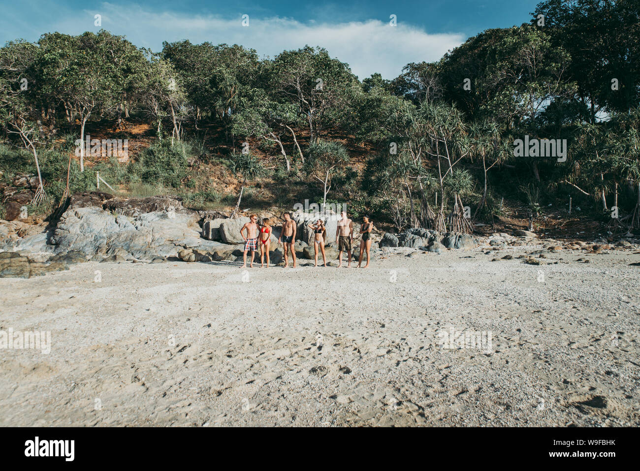 Group of friends having fun on the beach on a lonely island Stock Photo ...
