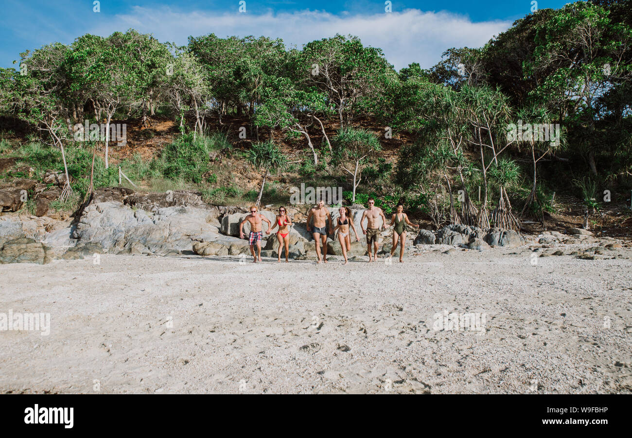 Group of friends having fun on the beach on a lonely island Stock Photo ...