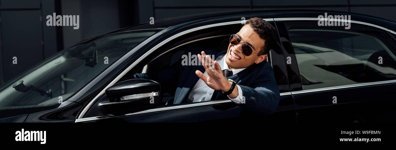 Person waving from car hi-res stock photography and images - Alamy
