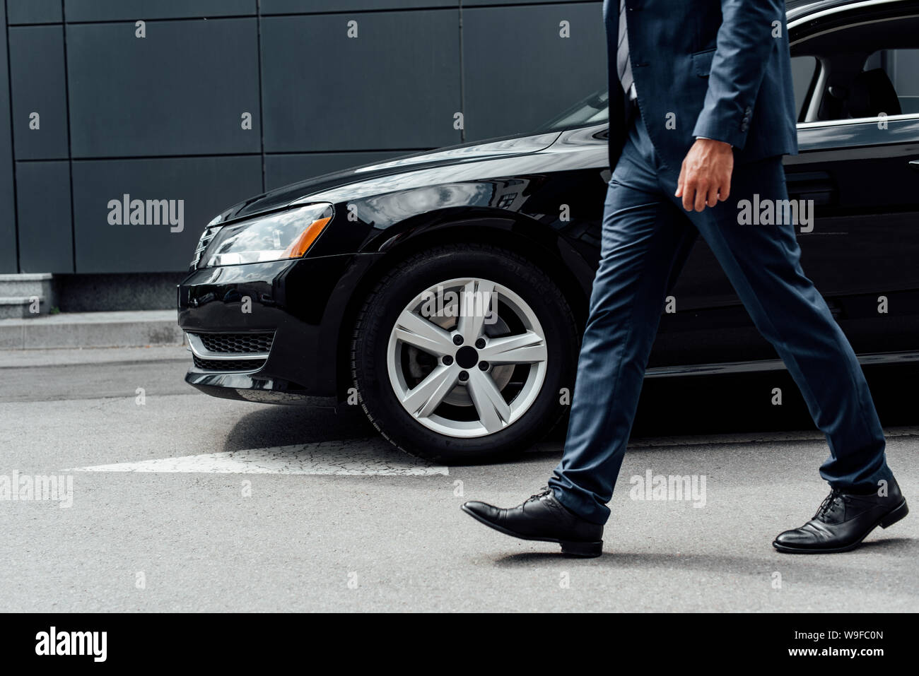 Man walking near parking hi-res stock photography and images - Alamy
