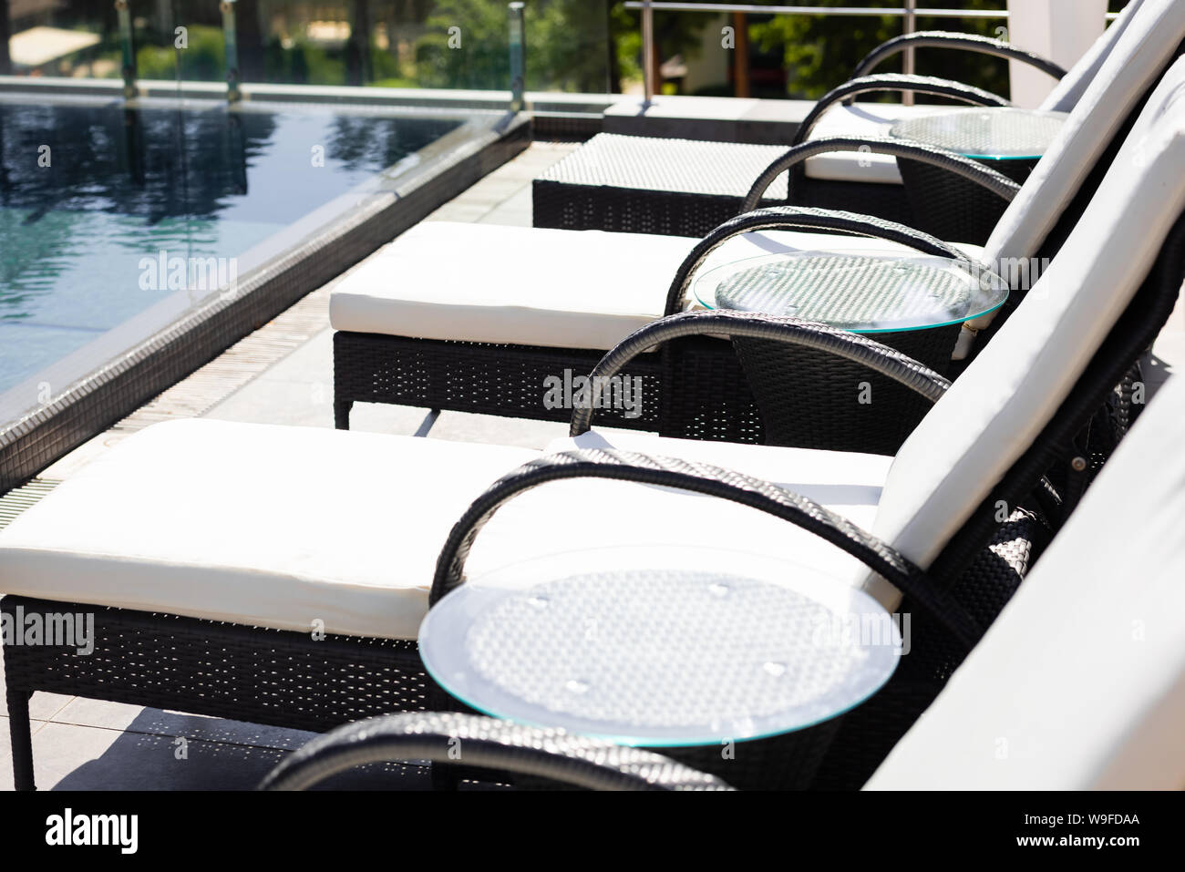 sun beds near swimming pool on resort during daytime Stock Photo - Alamy