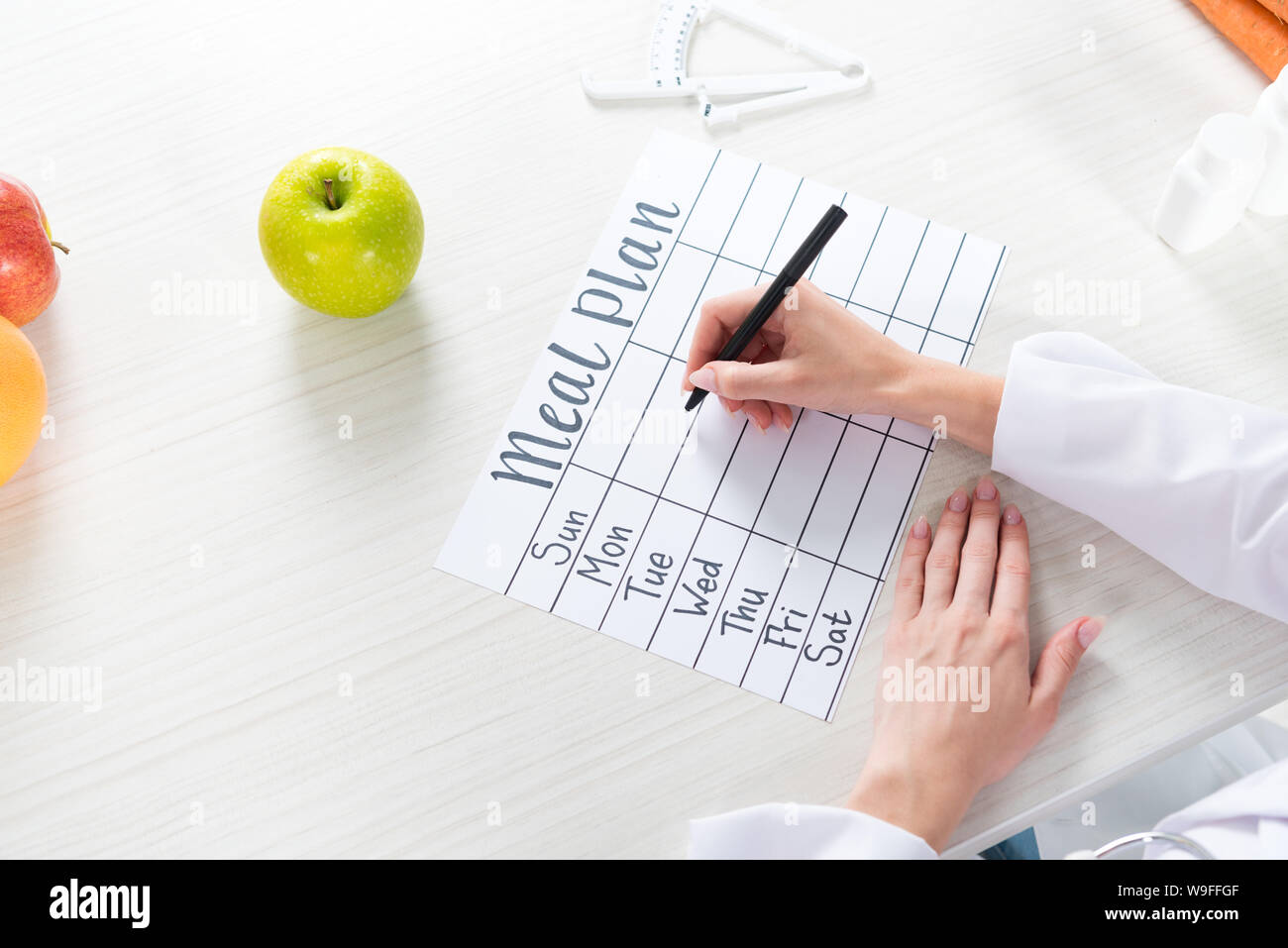 Dietitian writing diet plan hi-res stock photography and images - Alamy