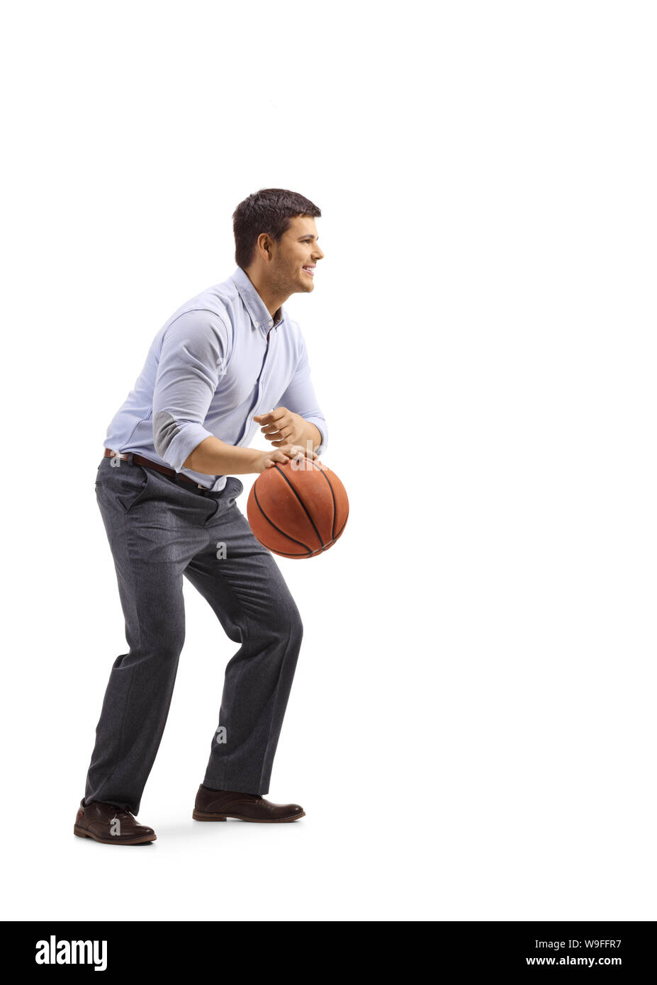 Happy young guy playing basketball hi-res stock photography and images ...