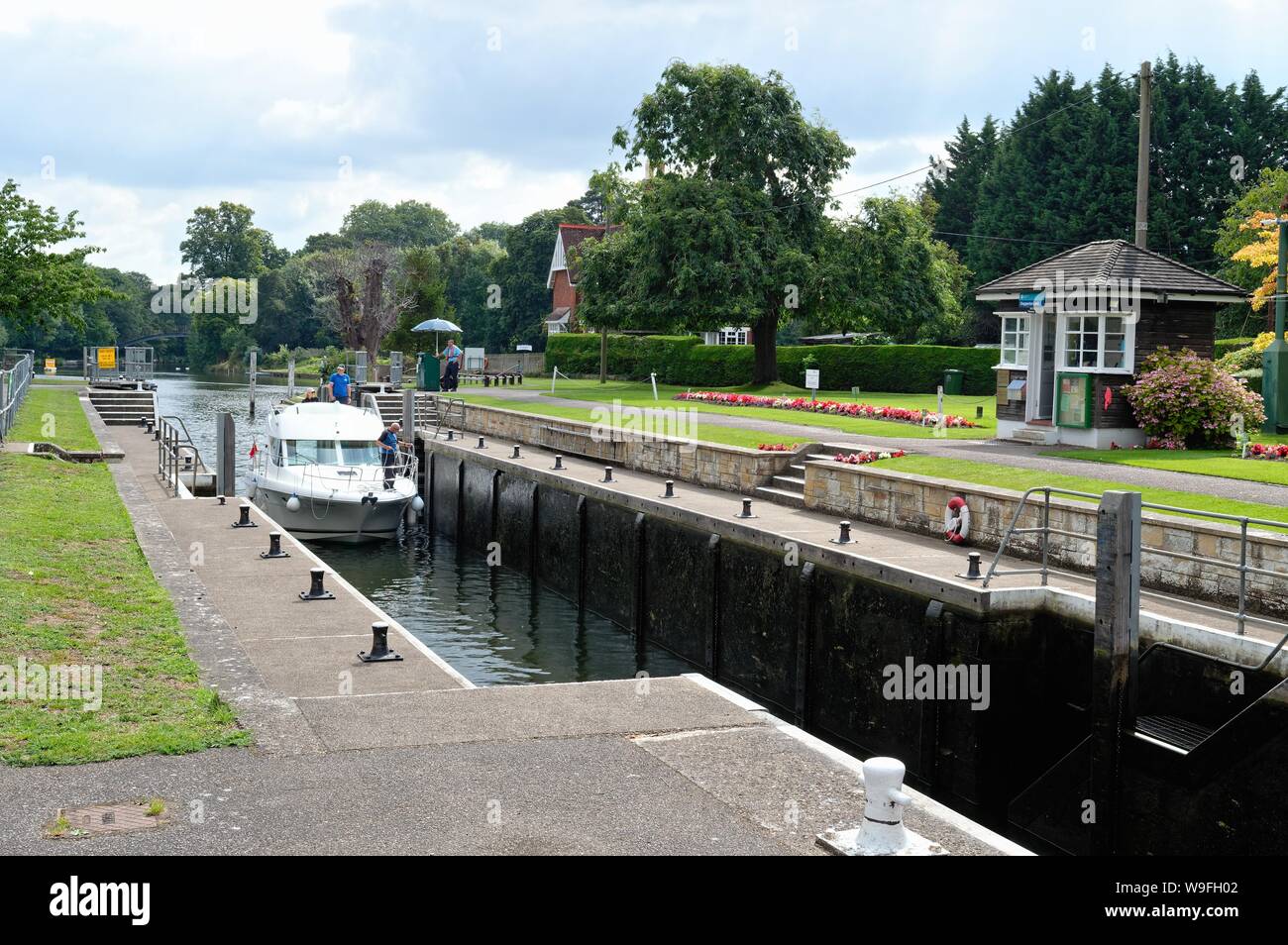A private leisure river cruiser passing through Shepperton lock on a ...