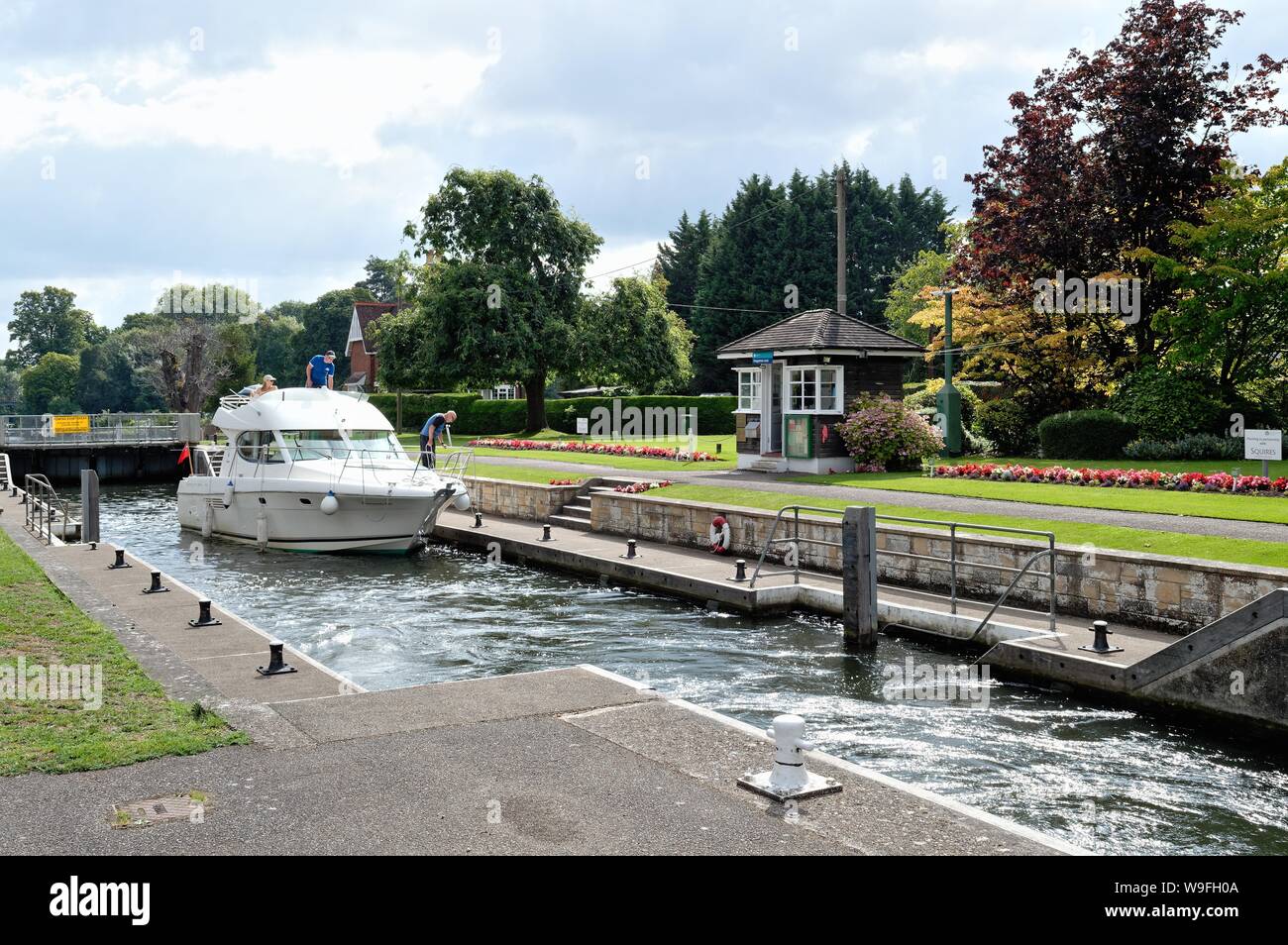 A private leisure river cruiser passing through Shepperton lock on a ...