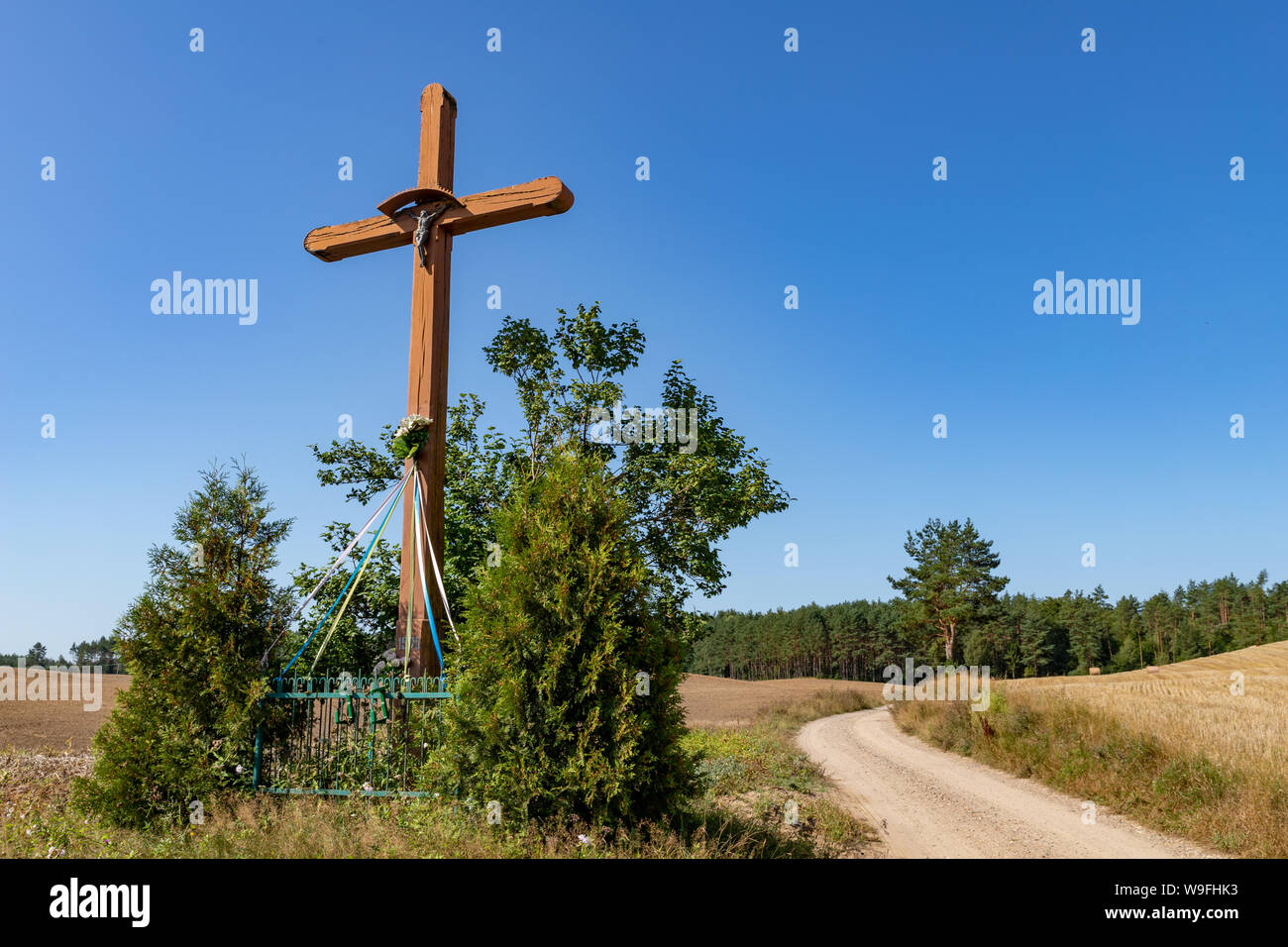A roadside wooden cross in Central Europe. Christian cross standing by ...