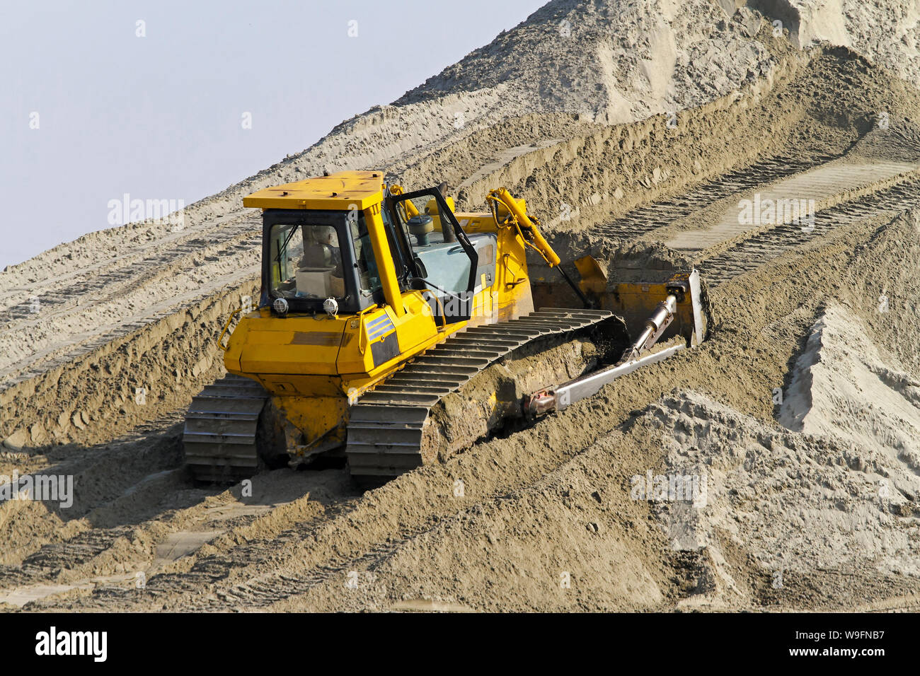 Bulldozer with track move sand at construction site Stock Photo - Alamy