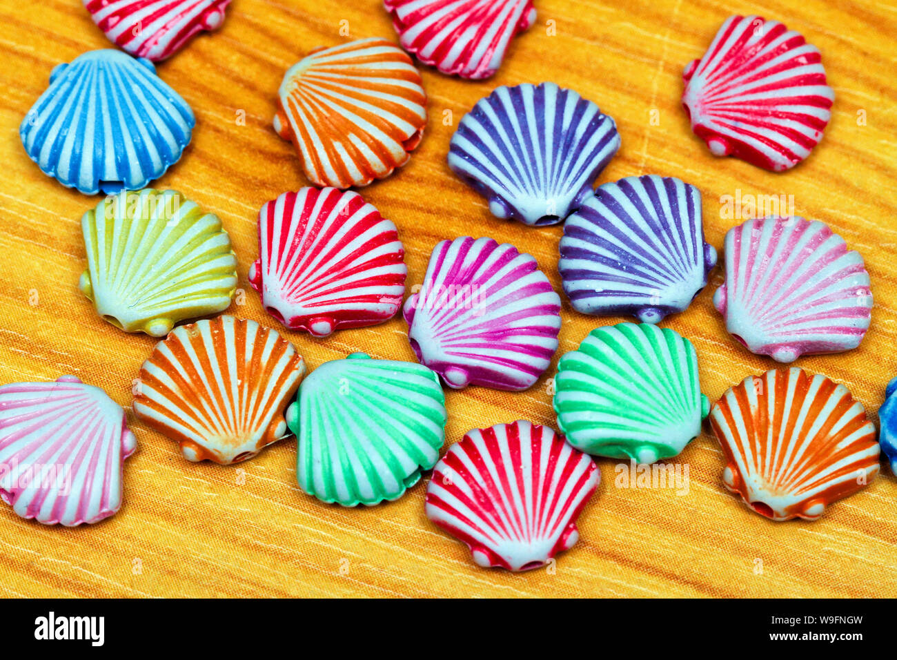 Multi colour plastic shells for beads craft Stock Photo - Alamy