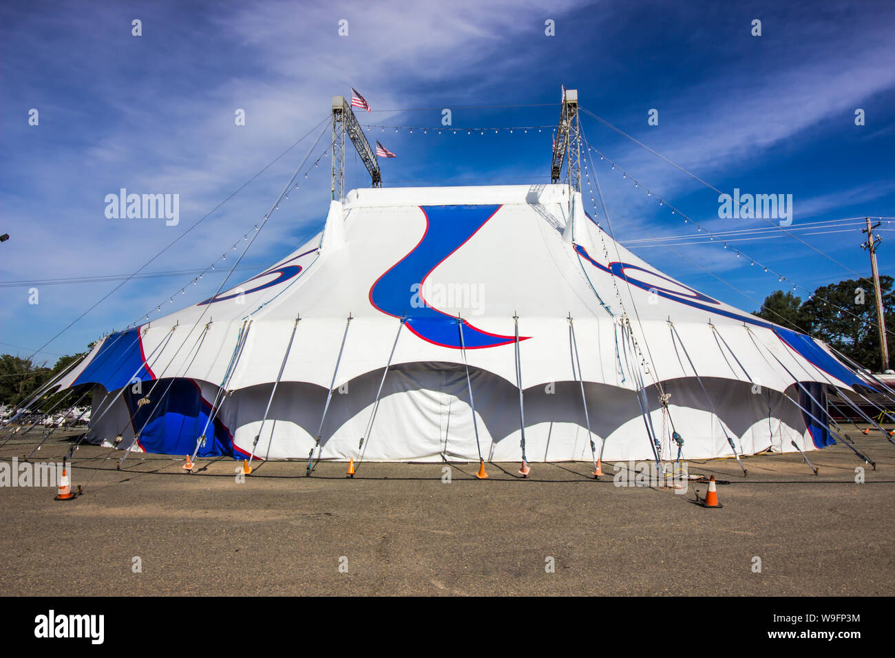 Blue & White Canvas Circus Tent With Tie Downs Stock Photo - Alamy