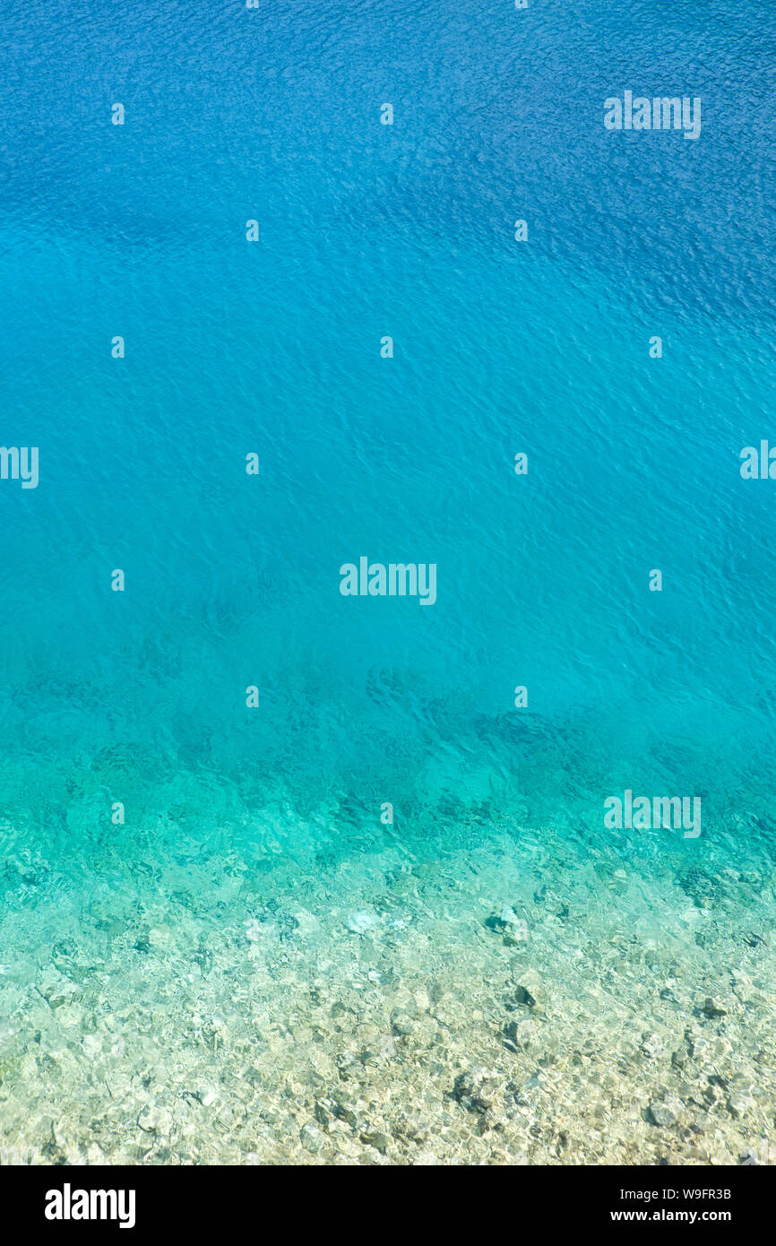 An aerial view of the clear water and turqouise, blue and aqua colors ...