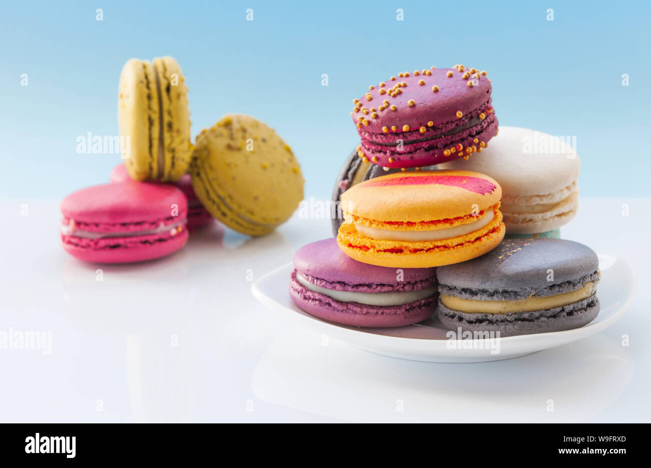 Stack of macaroons, French cookies on a white saucer. Holiday time ...