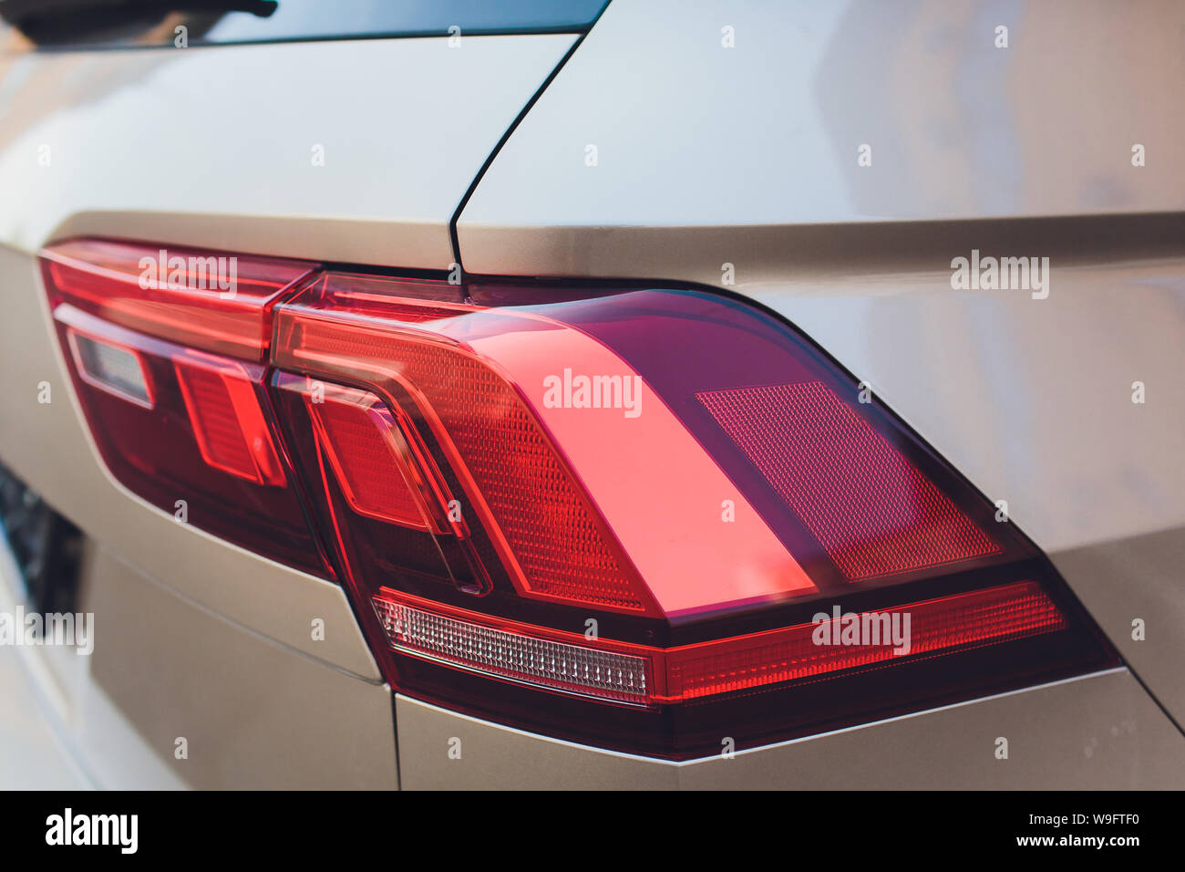 Closeup of car tail light on a white car Stock Photo - Alamy
