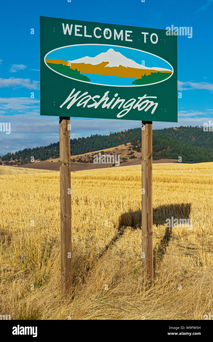 Washington, Tekoa, Welcome to Washington sign, yellow wheat field after ...