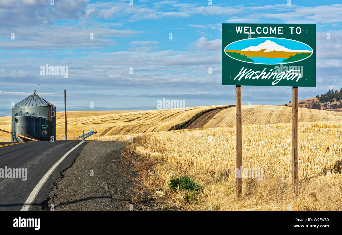 Washington, Tekoa, Welcome to Washington sign, yellow wheat field after ...