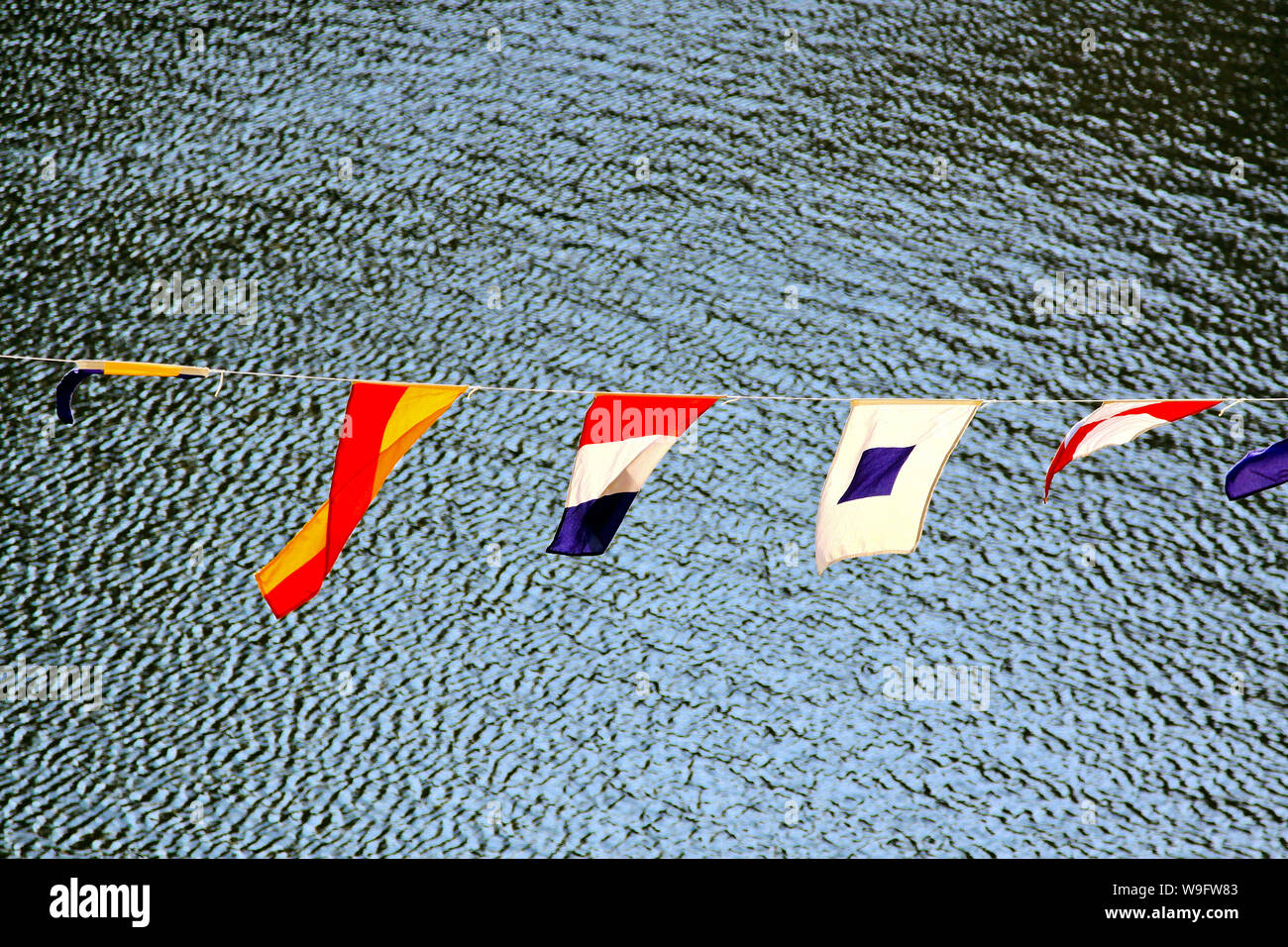 Bunch of decorative naval flags at rope Stock Photo - Alamy