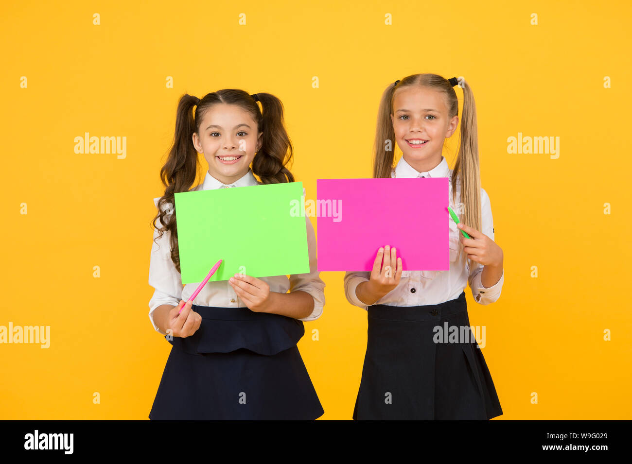 School girls show poster. Presentation poster copy space. Children ...
