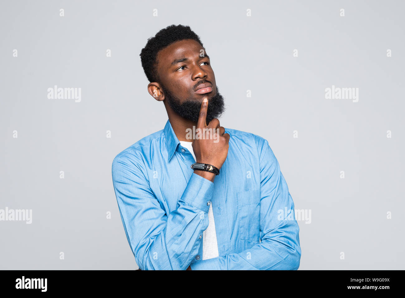 Young handsome African man thinking isolated on white background Stock ...