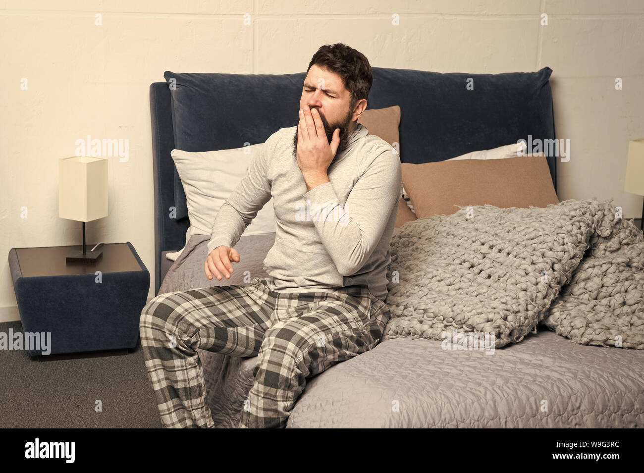 Get up early. Tips for waking up early. Man bearded hipster sleepy face ...