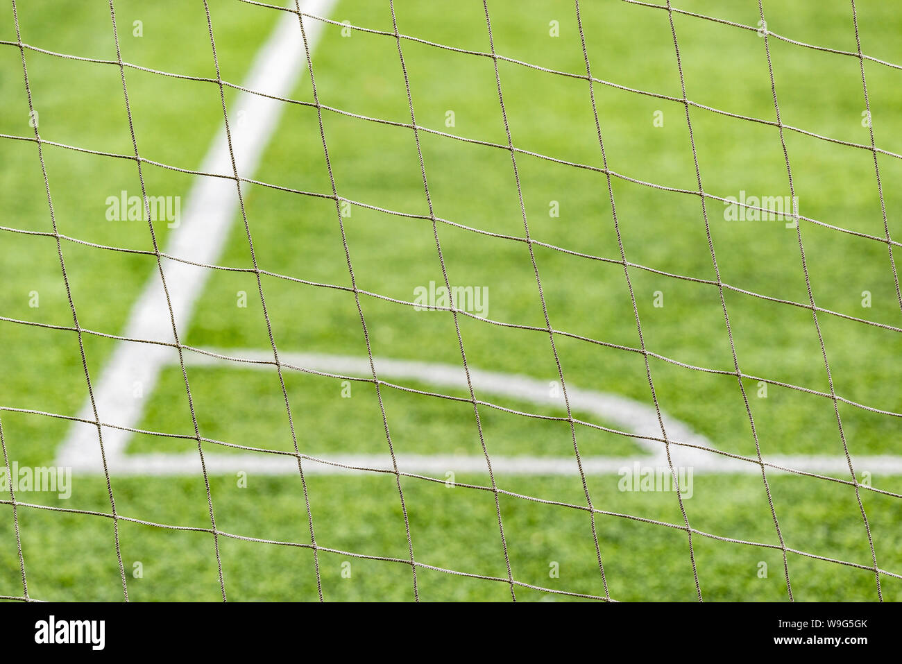 Net by the corner of soccer field Stock Photo - Alamy
